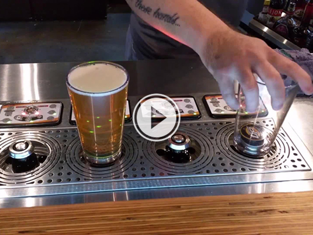 Dispenser fills beer glasses from the bottom