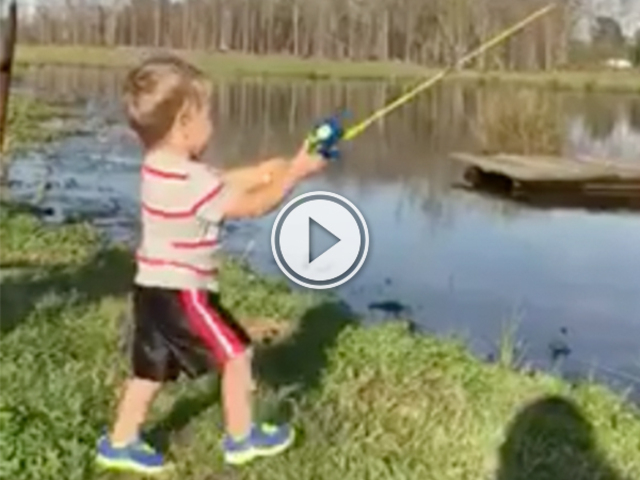 Cute kid catches monster fish