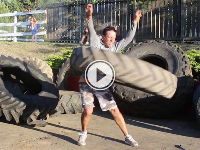 Guy uses giant tire as hula hoop