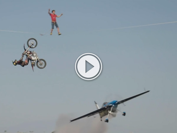 World First:plane under a high line and a back flipping biker (Video)