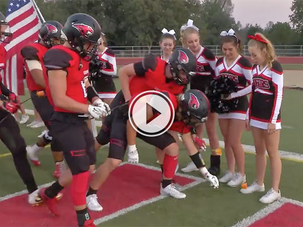 High school football team honors cheerleader with leukemia