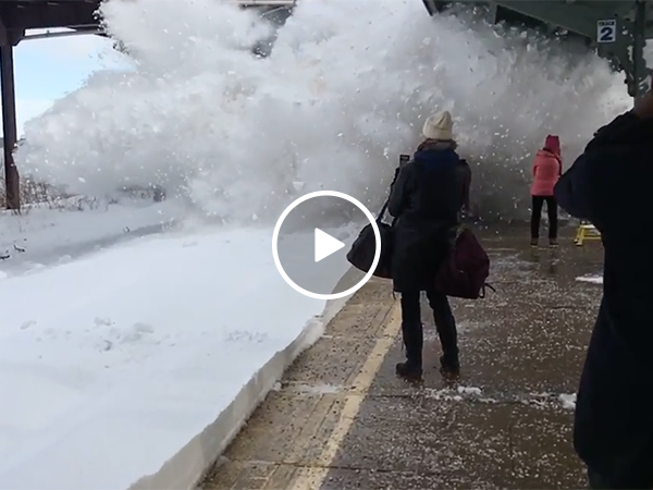Amtrak train plows through the snow in slow-motion