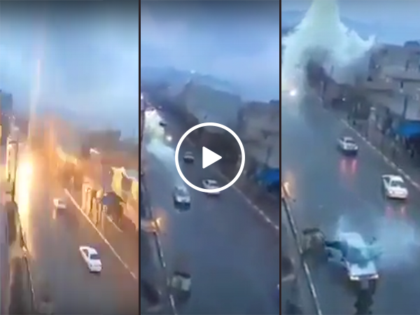 Lightning strikes a car as it drives down the road (Video)