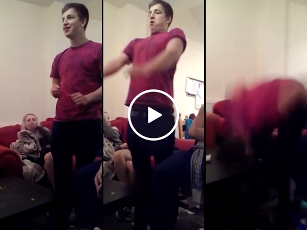 Guy smashes his head through a table and gets stuck (Video)