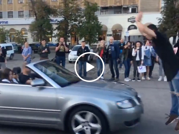 Guy tries to jump over speeding car and fails (Video)