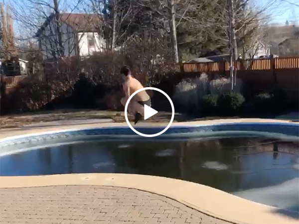Guy Jumps Into Cold Frozen Pool with a Speedo and Ice