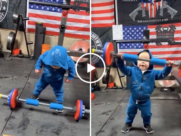Powerlifting baby has terrible form, but we'll overlook that. He's cute ...