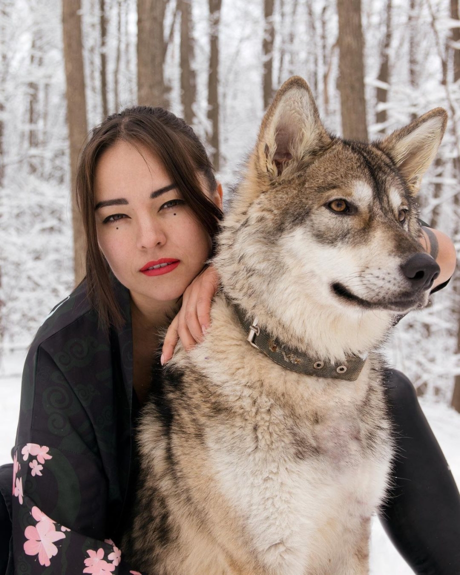 A woman and wolf have become inseparable after she adopted the pup